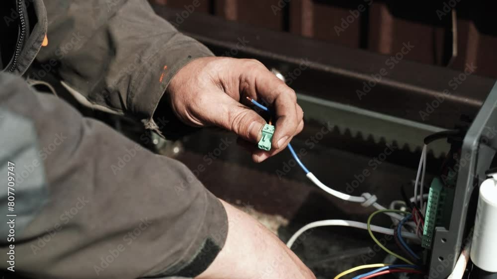 Electrician installs wiring using Connectors for connecting wires in ...