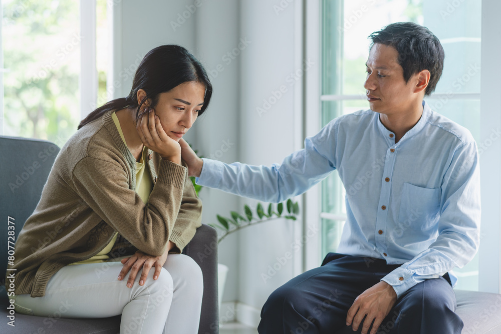 mental health treatment concept. Stressed asian patient talking with personal psychologist in ...