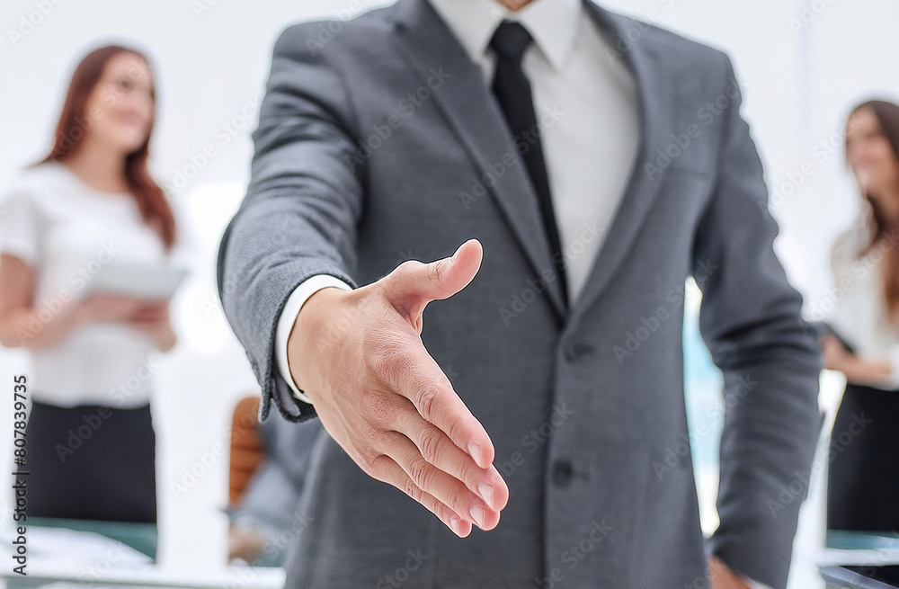 Businessman extending hand for handshake in the office background Stock ...