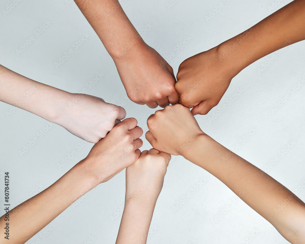 Team and friendship. Close up of hands clenched in fist meeting join ...