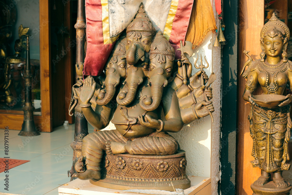 Bronze multi-armed and multi-headed Ganesha and Deepa Lakshmi. Stock ...