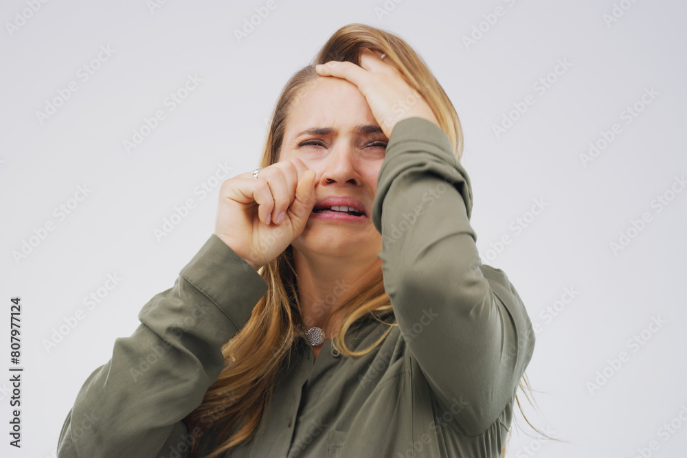 Crying, stress and sad woman with depression, crisis and pain in studio ...