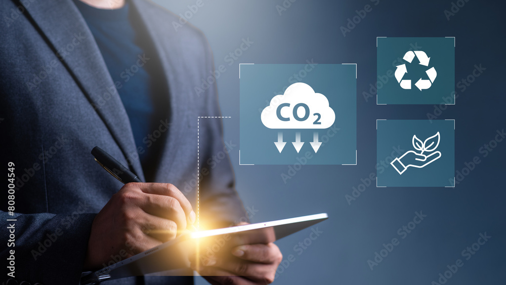 Reduce co2 emission. man using software to lower CO2 emissions to limit ...