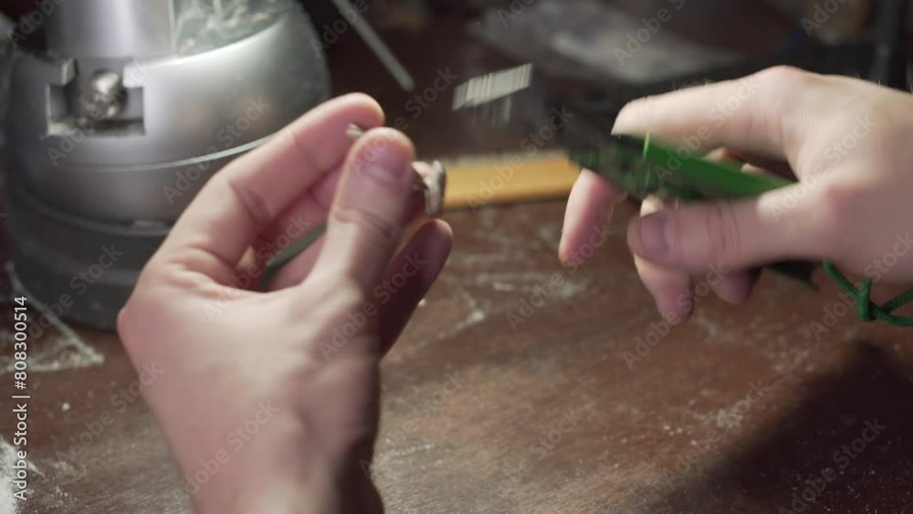 Jeweler separates the silver billets with wire cutters. Goldsmith at ...