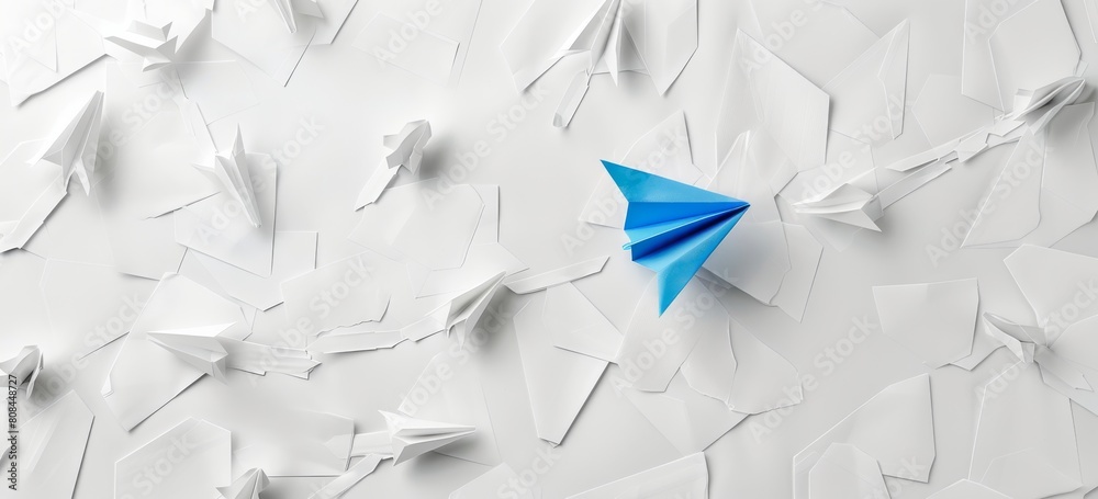 Blue paper airplane leading the way, surrounded by many white ...