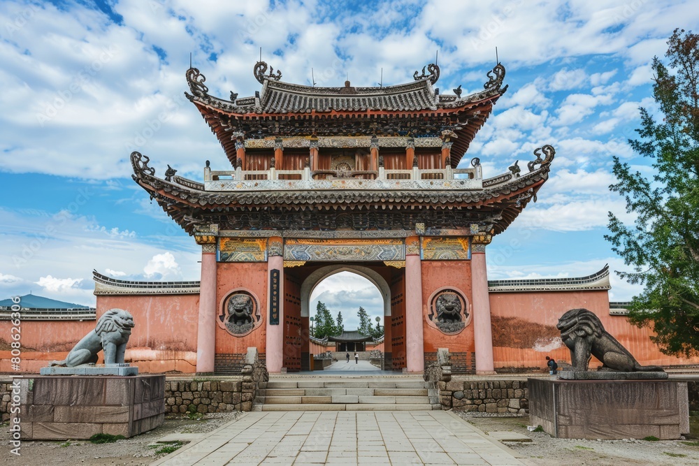A historic Chinese city gate with towering walls, ornate archways, and ...