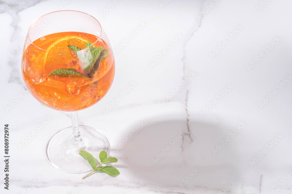 Classic italian aperitif aperol spritz cocktail in glass with ice cubes ...