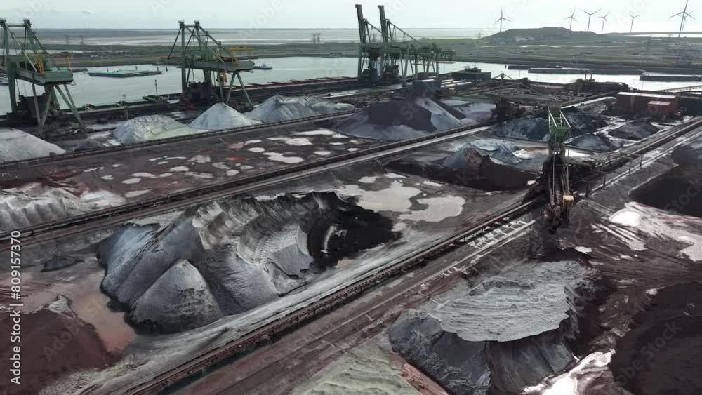 Flying over industrial port and warehouse for fossil fuels, coal and ...