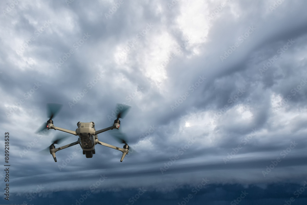 UAV drone copter flying with digital camera.Drone with high resolution ...