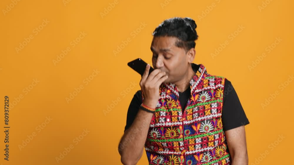 Irked indian man fighting with friends during telephone call, isolated ...