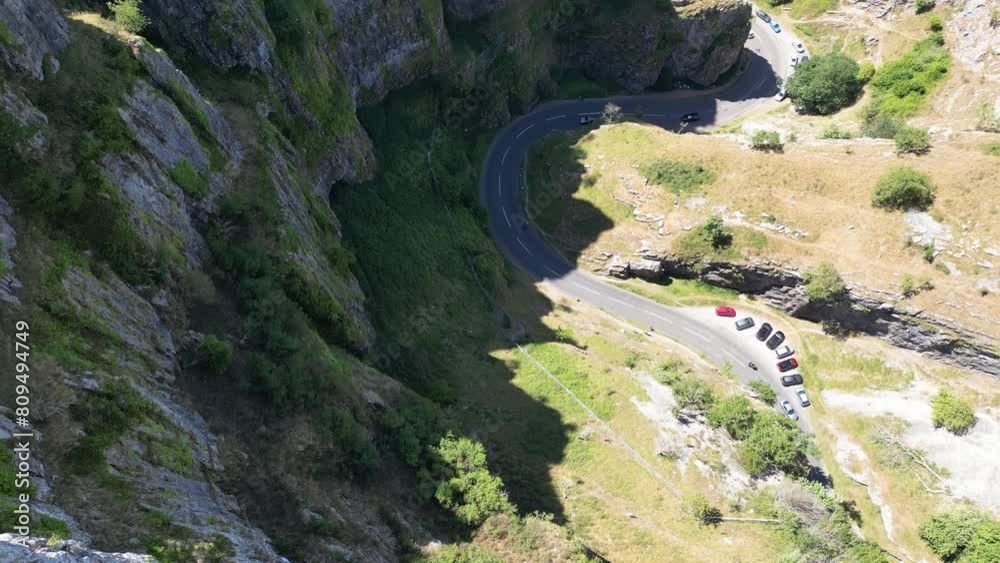 Drone footage of Cheddar Gorge Mountain landscape with winding road in ...