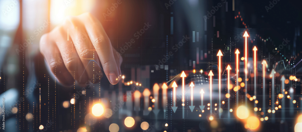 Stockfoto med beskrivningen Banner, A hand is pointing at a graph with ...