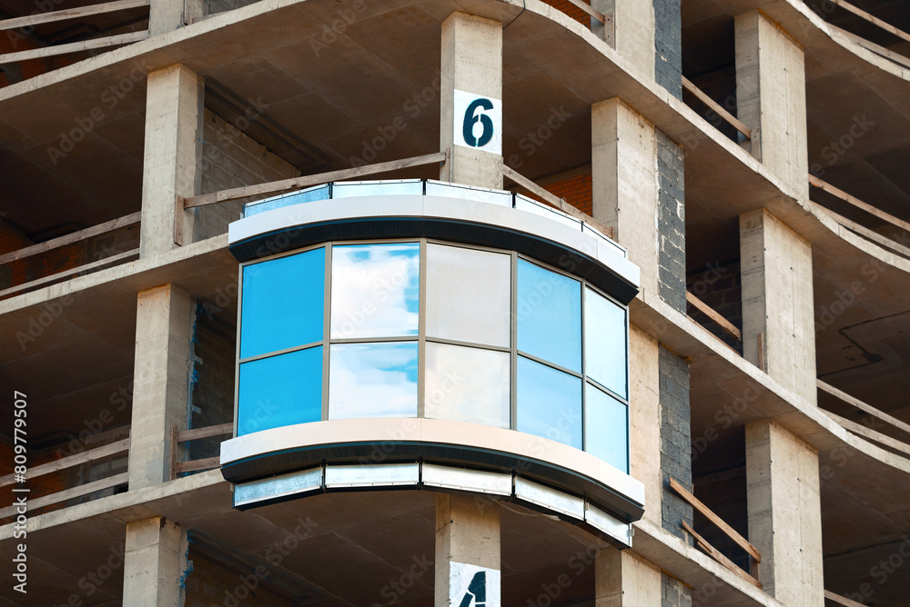 Glass panel installed on facade. Installation of unitized curtain wall ...