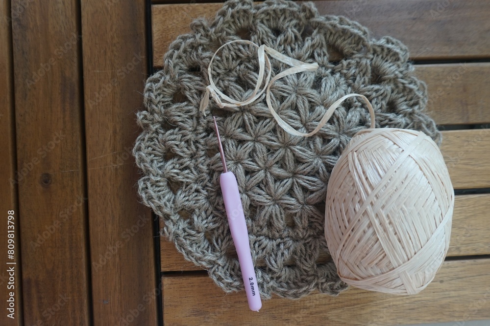 raffia balls . A bobbin of yarn lies on hooks. side view of a textile ...