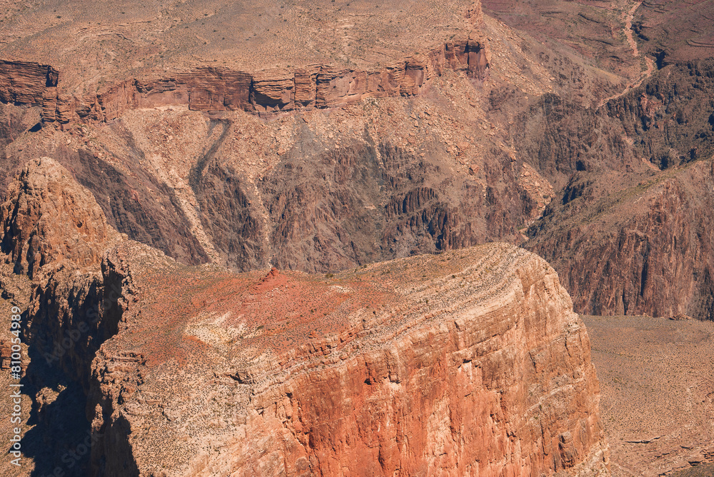 Dramatic canyon landscape with red, orange, and brown sedimentary rock ...