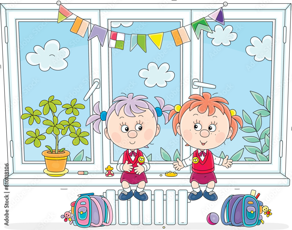 Funny little schoolgirls with their schoolbags sitting on a windowsill ...