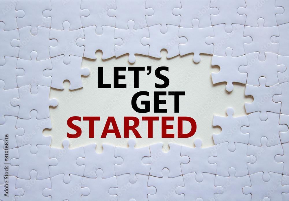 Lets get started symbol. Concept words Lets get started on white puzzle ...