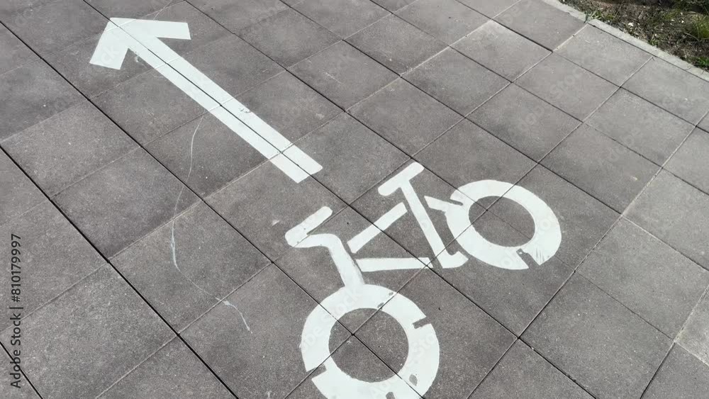 Bike path. Painted bicycle road sign and arrow marking with specified ...