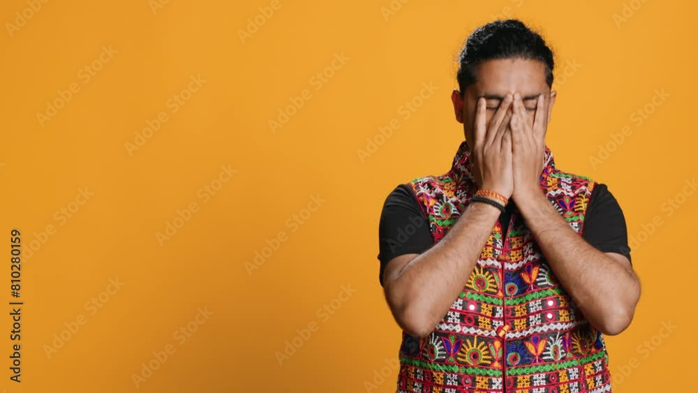 Anxious indian man covering face with palms, worried about future ...