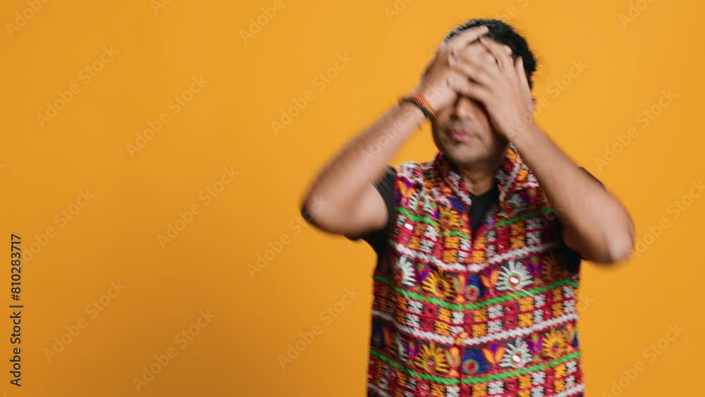 Indian man covering face with palms in disbelief, feeling upset by ...