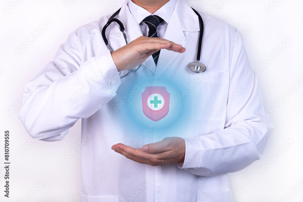 Health insurance concept. A doctor with a stethoscope holds his hands ...