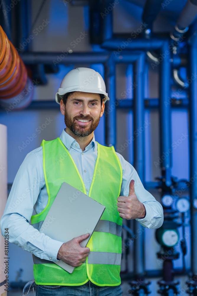 Engineer show thumb up and hold laptop computer checking and inspecting ...
