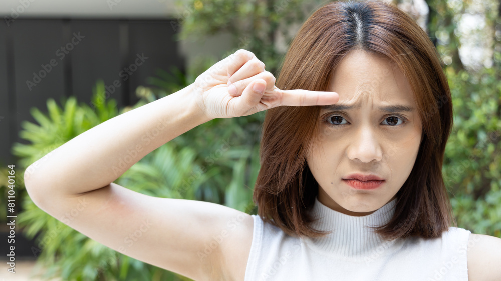 Angry upset young asian woman frowning, raising eyebroes and having ...