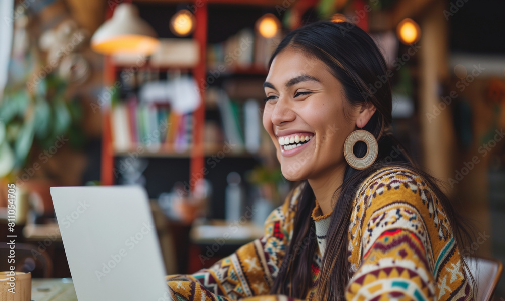Happy Native American Indian woman on video call on laptop at home ...