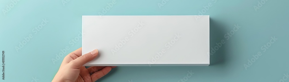 Display standee held with mockup showcased, hand adjusting the position ...