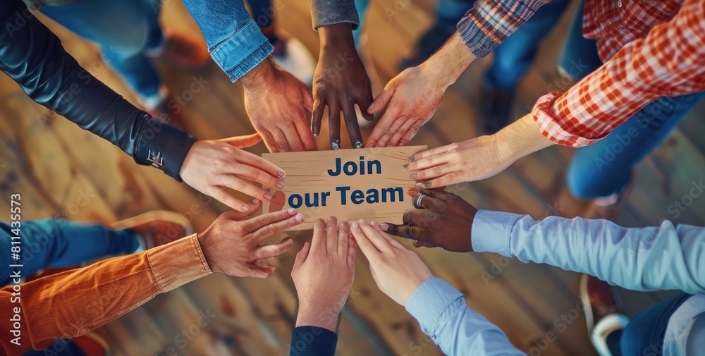 top view of group people holding hands together and forming circle ...
