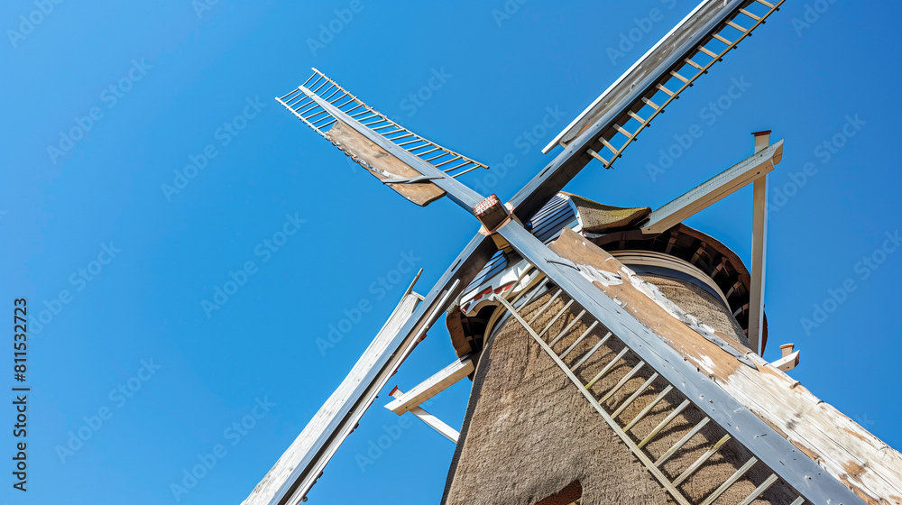 The windmill is photographed up close, showing the beautiful and iconic ...