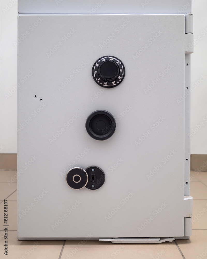 front panel of the ATM safe with a password dial with limb and a lock ...