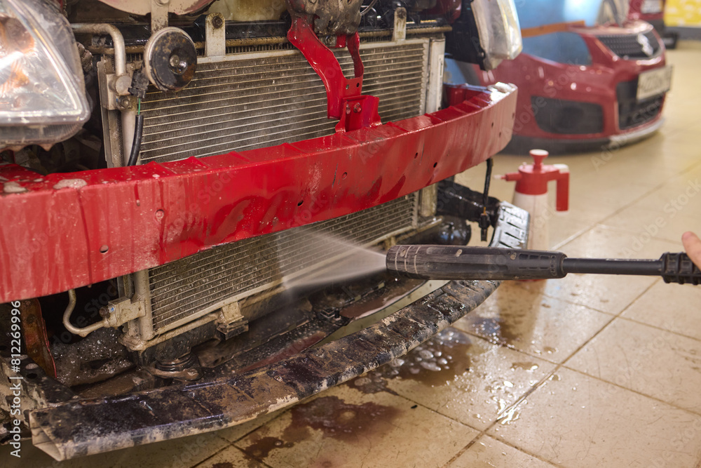 Modern car in a car service. The front of the machine is partially ...