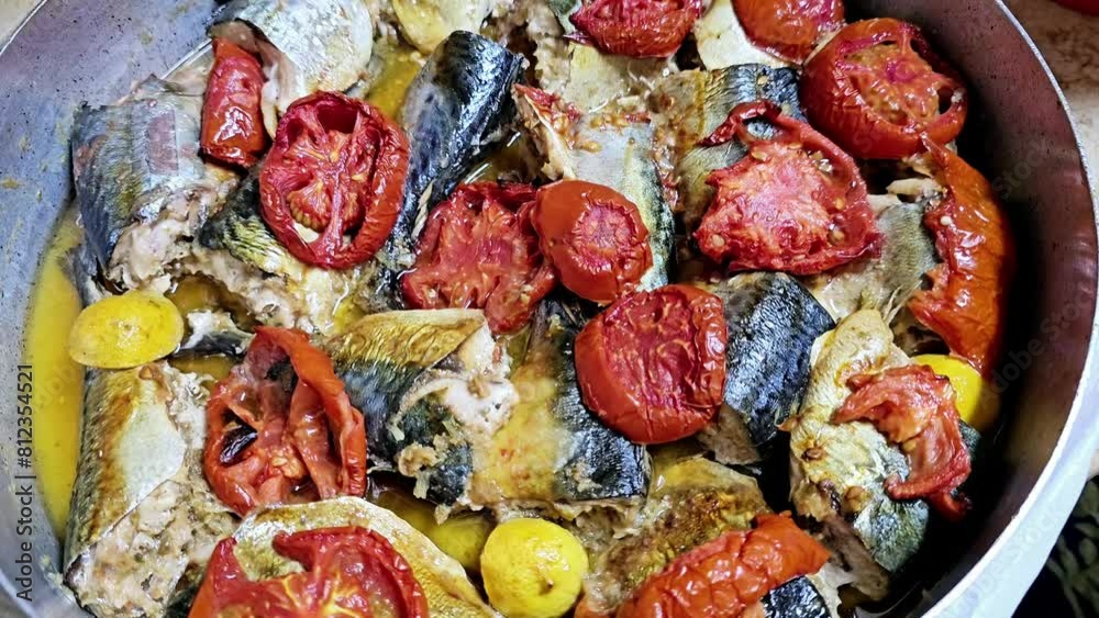 Mackerel fish, baked and cooked with tomatoes, different species of ...