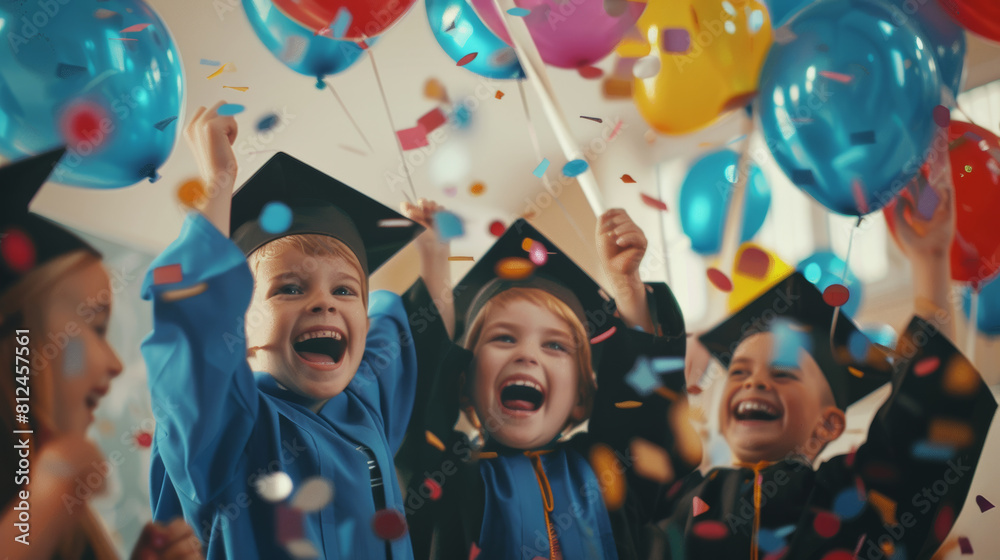 Joyous children in graduation caps celebrating with colorful balloons ...