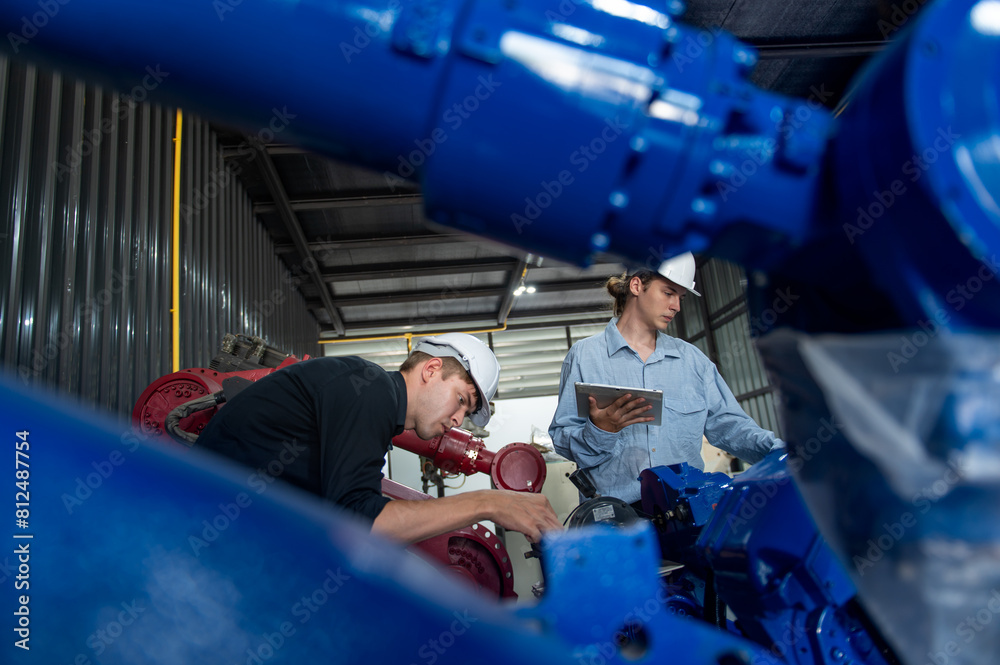 Engineer inspection control a robot arm welding machine with a remote ...
