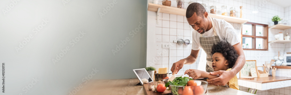 African American Little Afro child boy and his father cooking together ...