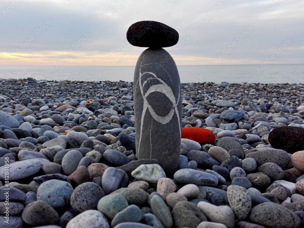 Stones pyramid or tower on pebble beach symbol stability zen harmony ...