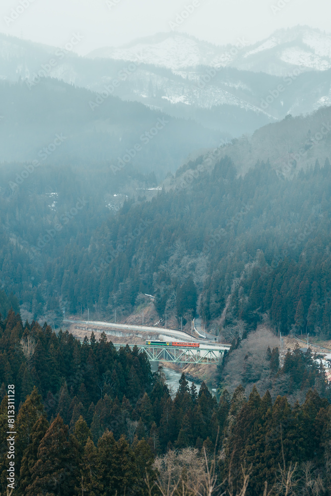 Panoramic View of Japan local train with Tadami river and bridge ...