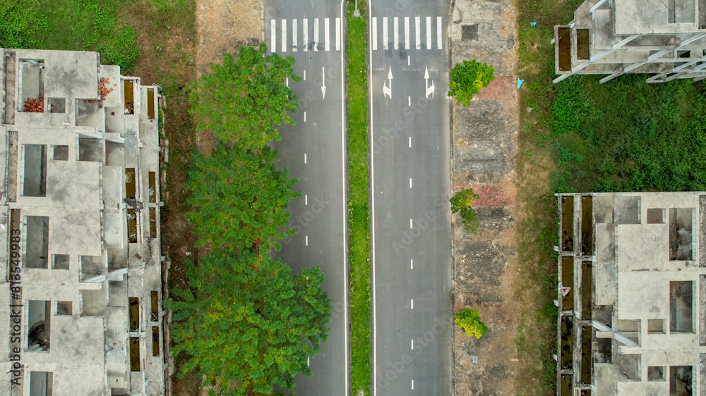 Aerial view of a symmetrical urban street separating two rows of ...