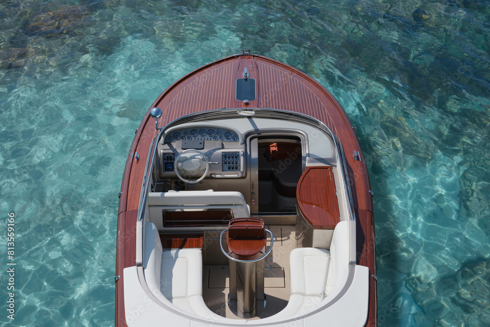 Expensive wooden boat on blue azure water, top view. Exclusive ...