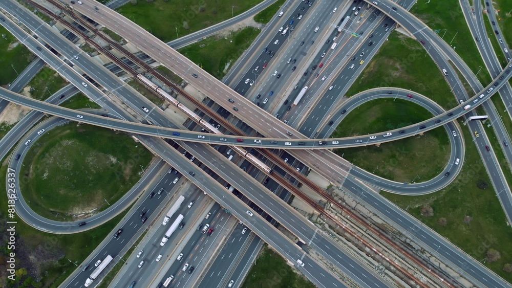Aerial highway junction bustling with traffic, urban connectivity ...