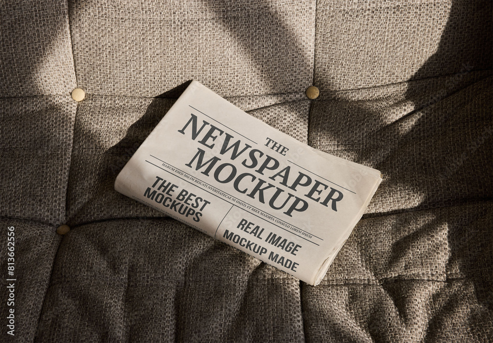 Mockup of folded customizable newspaper Stock Template | Adobe Stock