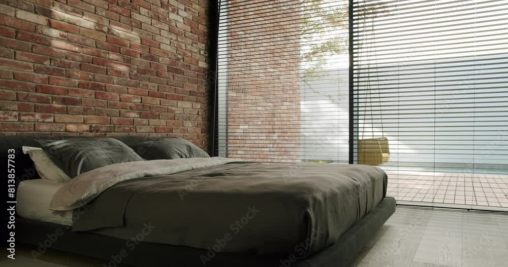 Stylish bedroom featuring a large cozy bed, brick wall, and a stunning ...