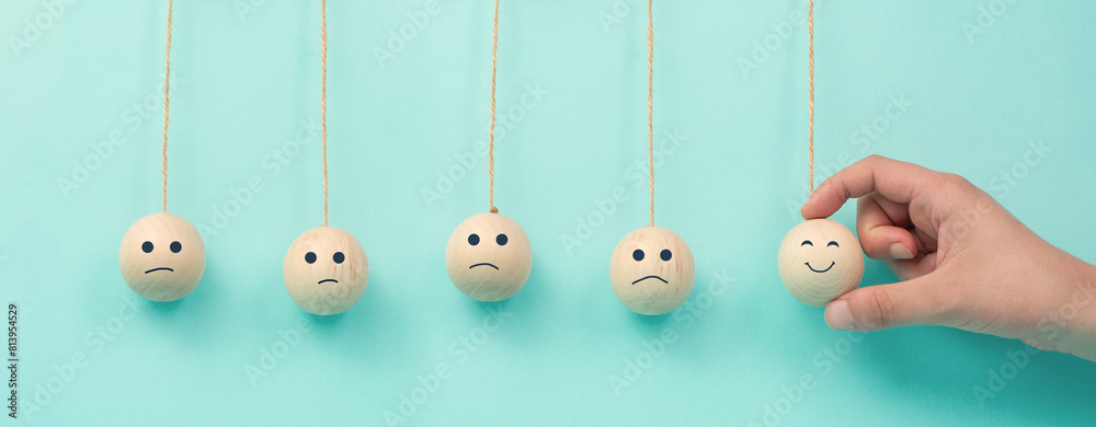 Happy smiling face spread happiness to sad faces, newton cradle concept ...