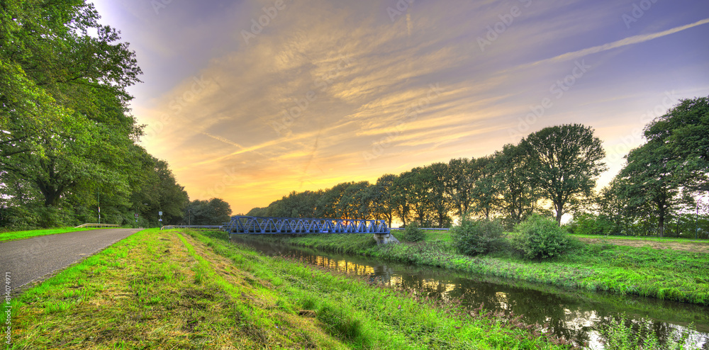 Steel bridge "Laarbrug" spanning the Wilhelminakanaal canal. Set in a ...