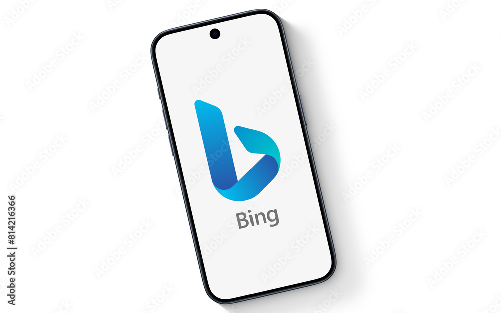 Bing logo is displayed on a modern smartphone with shadow laying on a ...