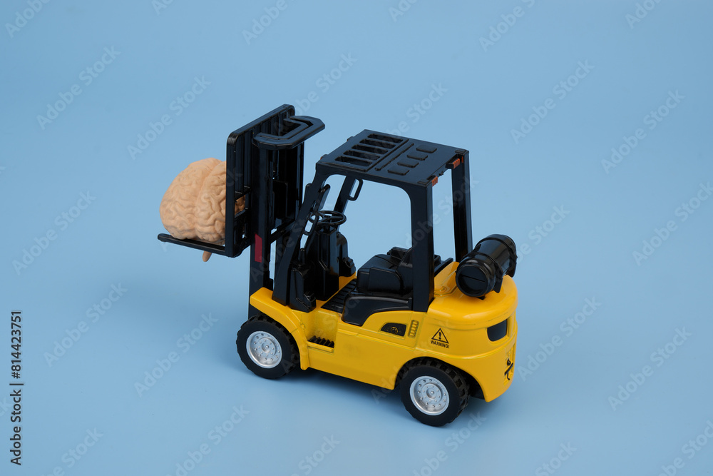 Forklift truck carrying human brain on blue background. Smart logistics ...