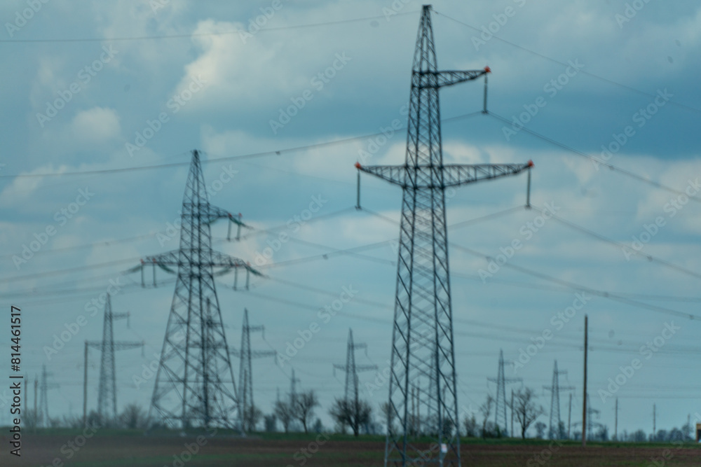 High voltage towers with sky background. Power line support with wires ...