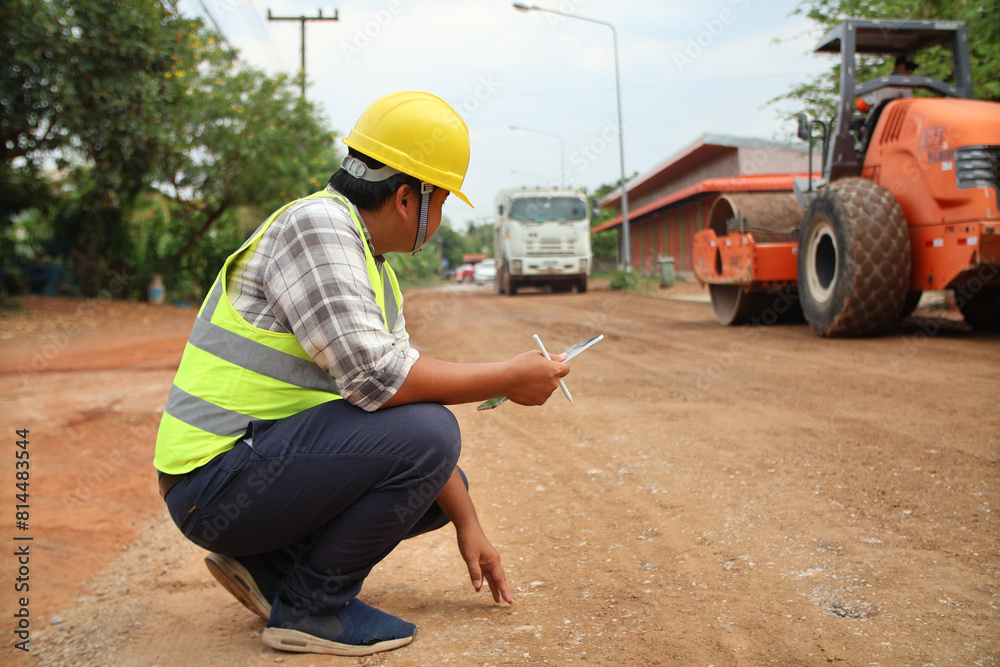 Road construction inspector Standing and inspecting work at the ...